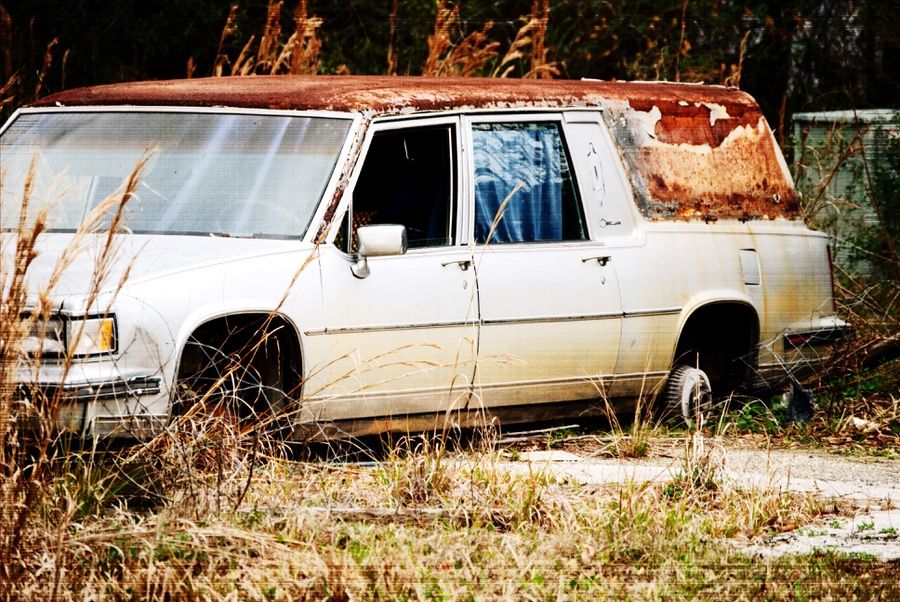 18 Spooky Pictures Of Deserted Hearses
