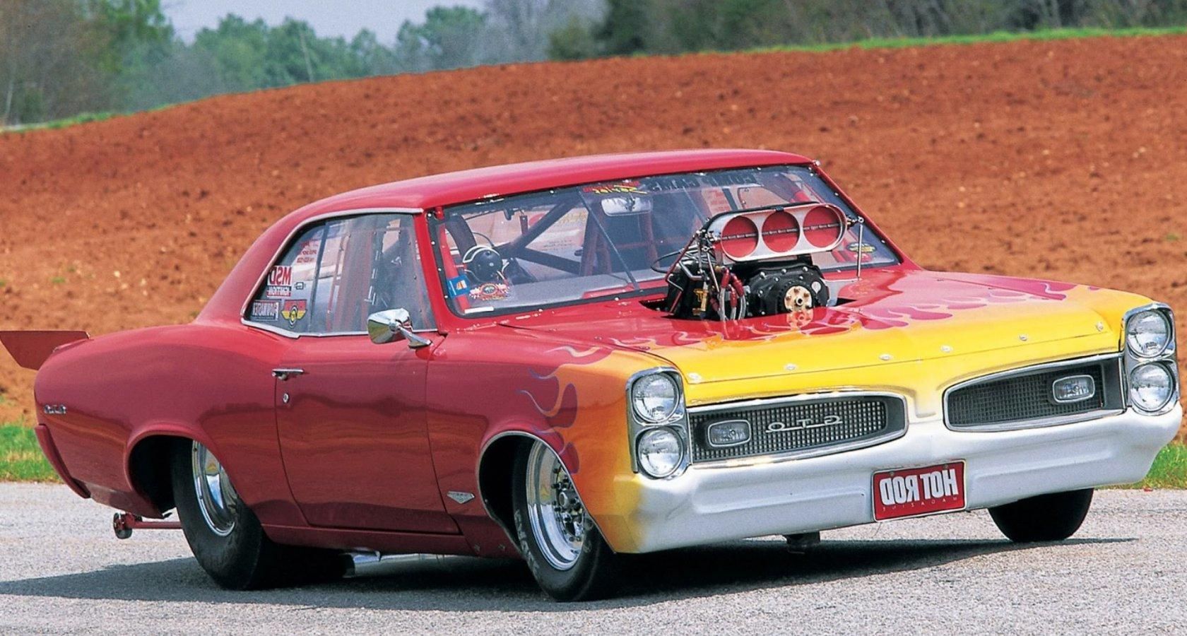 15 Beast Photos Of Muscle Cars With Oversized Engines