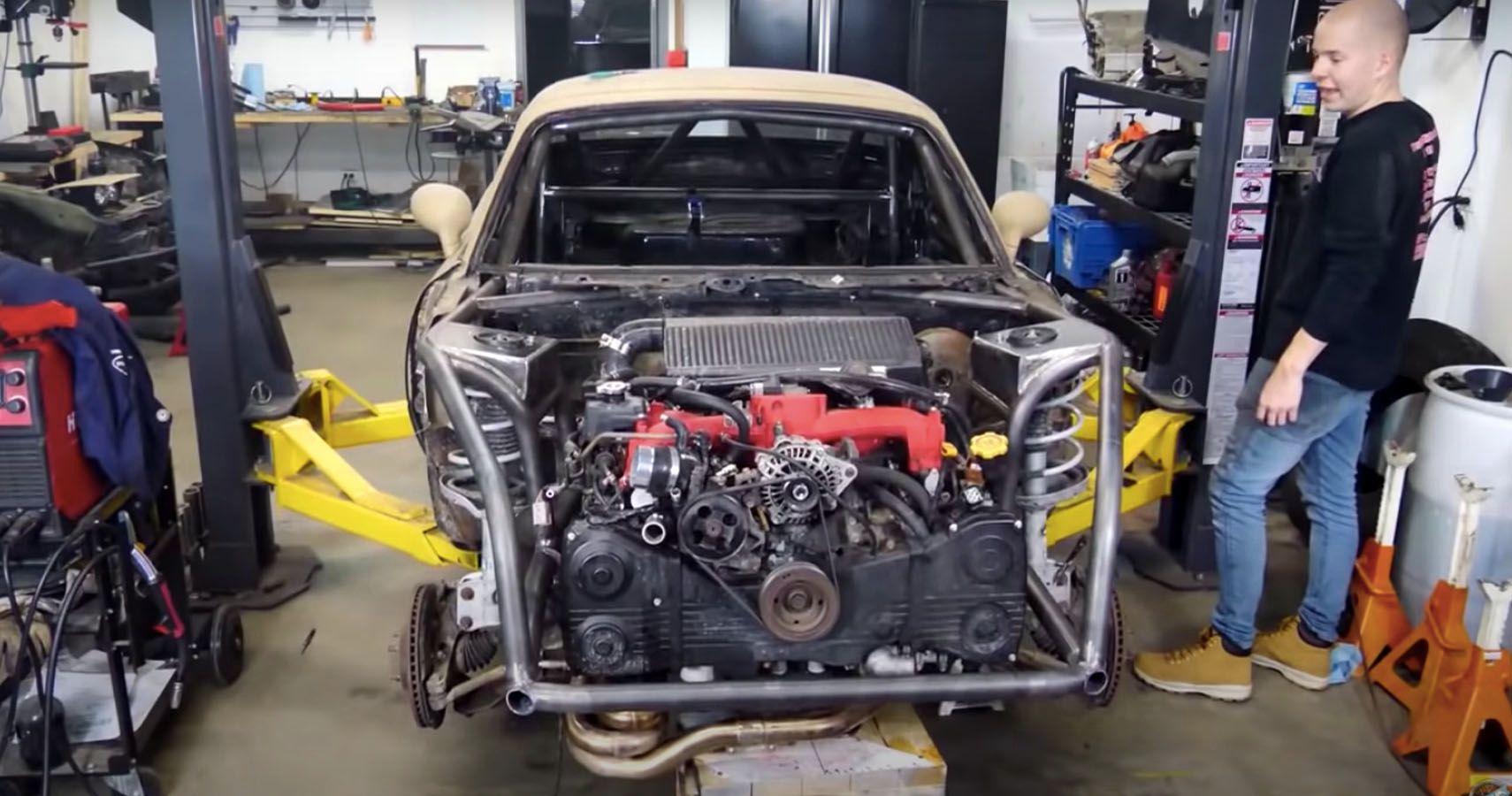 Watch This Mazda Miata Get A Lift And AWD Swap Before Blasting Across Sand