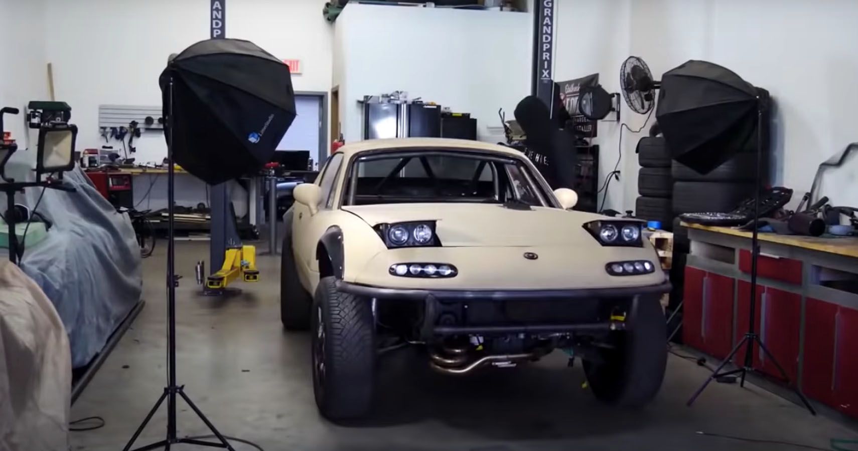 Watch This Mazda Miata Get A Lift And AWD Swap Before Blasting Across Sand