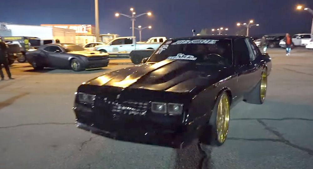 Watch This Monte Carlo Donk Destroy A Tesla Model S Plaid On The Drag Strip