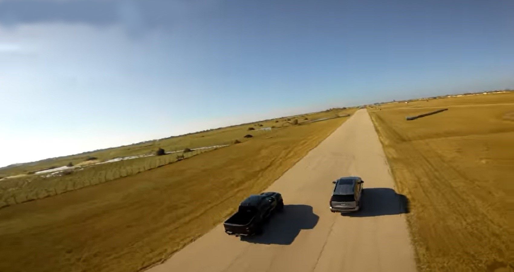 Here's How Close The Cadillac Escalade And Ram TRX Are In A Drag Race